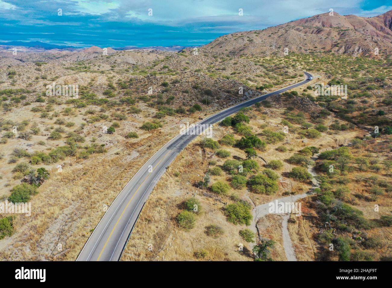 Aerial view of the landscape of the mountains and the road that goes ...