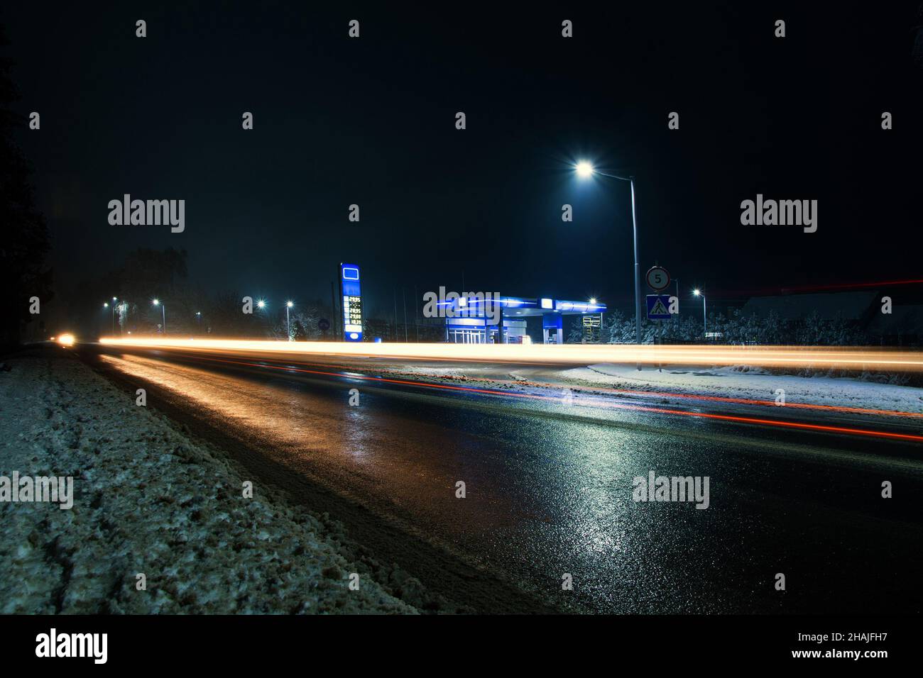 gas station and convenience store at night Stock Photo - Alamy
