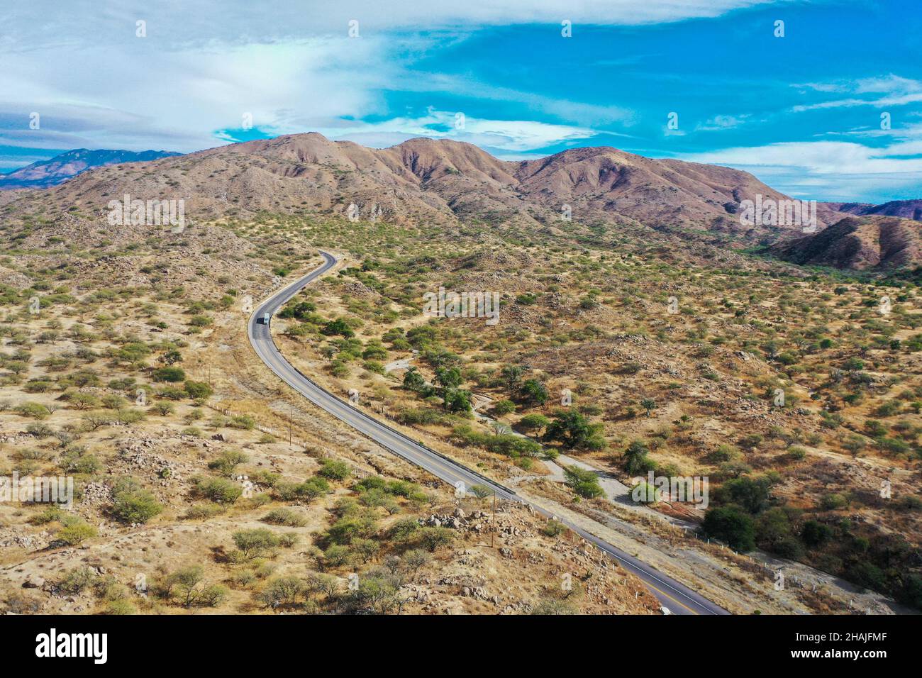 Aerial view of the landscape of the mountains and the road that goes ...