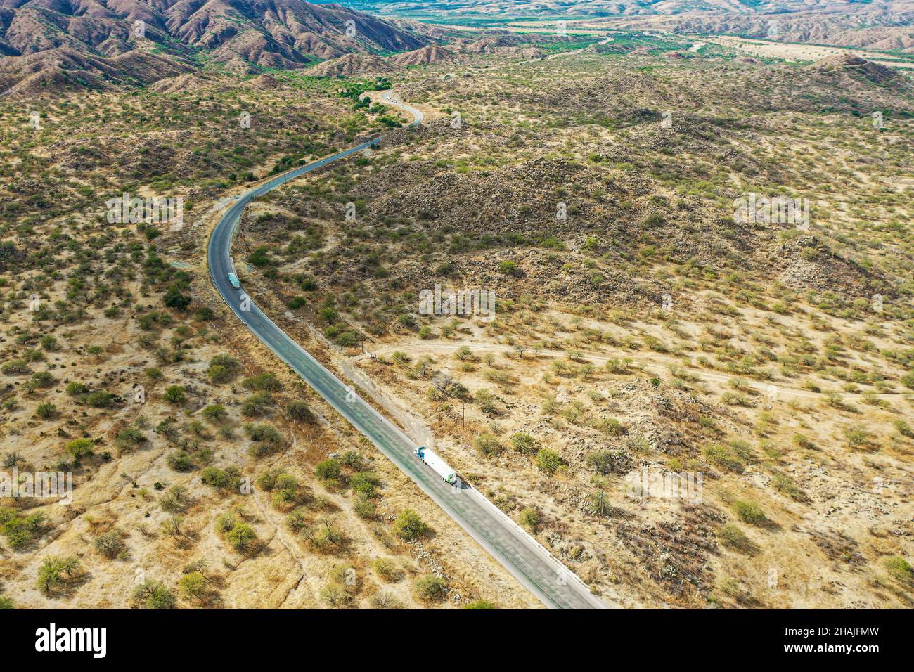 Aerial view of the landscape of the mountains and the road that goes ...