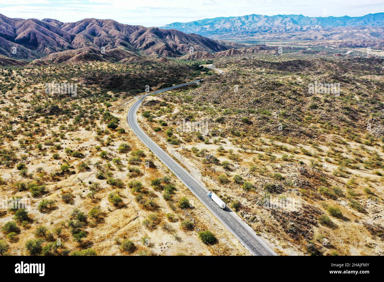 Aerial view of the landscape of the mountains and the road that goes ...
