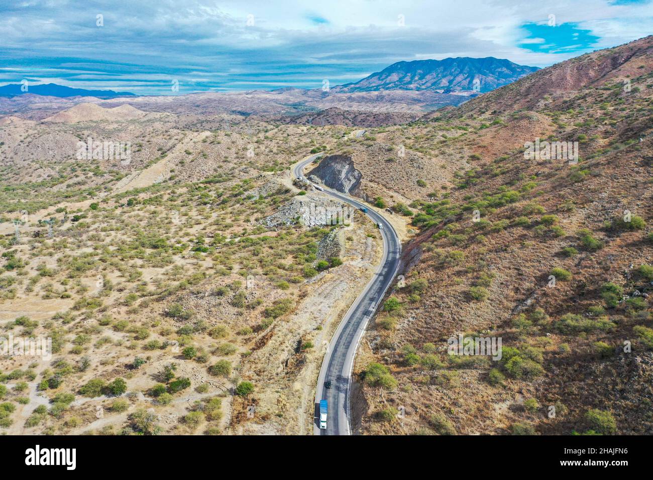 Aerial view of the landscape of the mountains and the road that goes ...