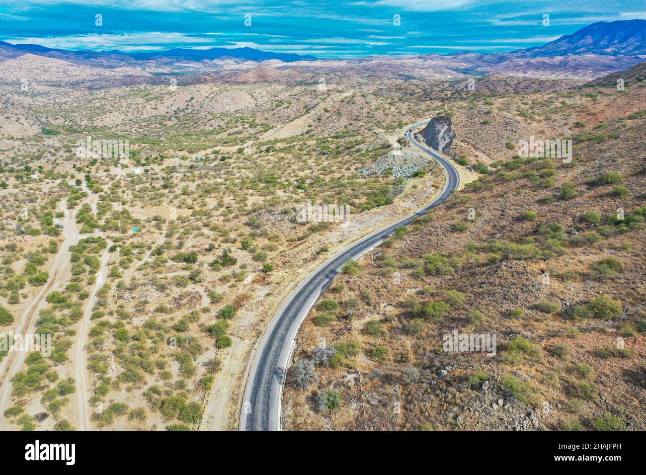 Aerial view of the landscape of the mountains and the road that goes ...