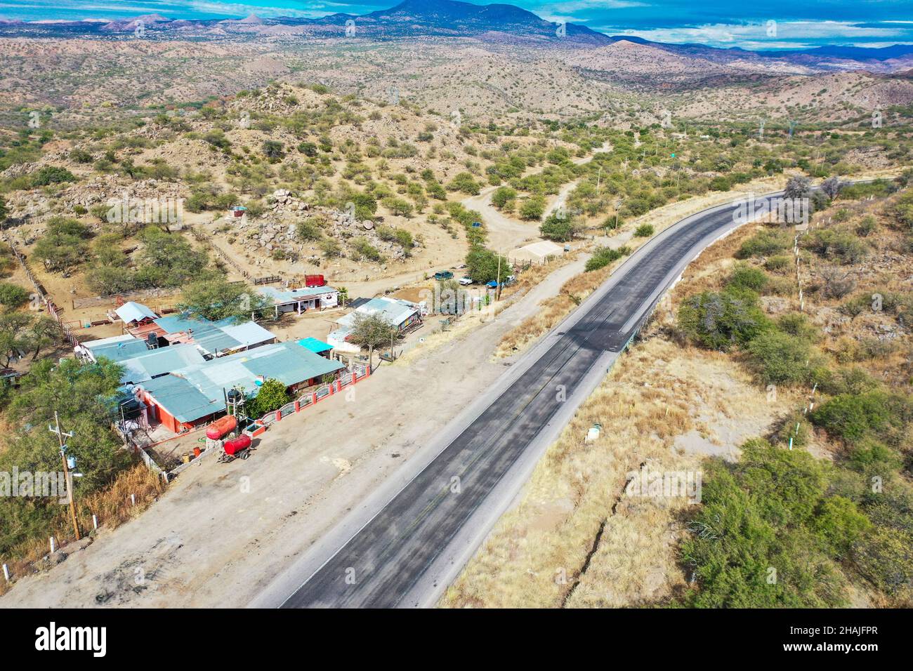 Aerial view of the landscape of the mountains and the road that goes ...