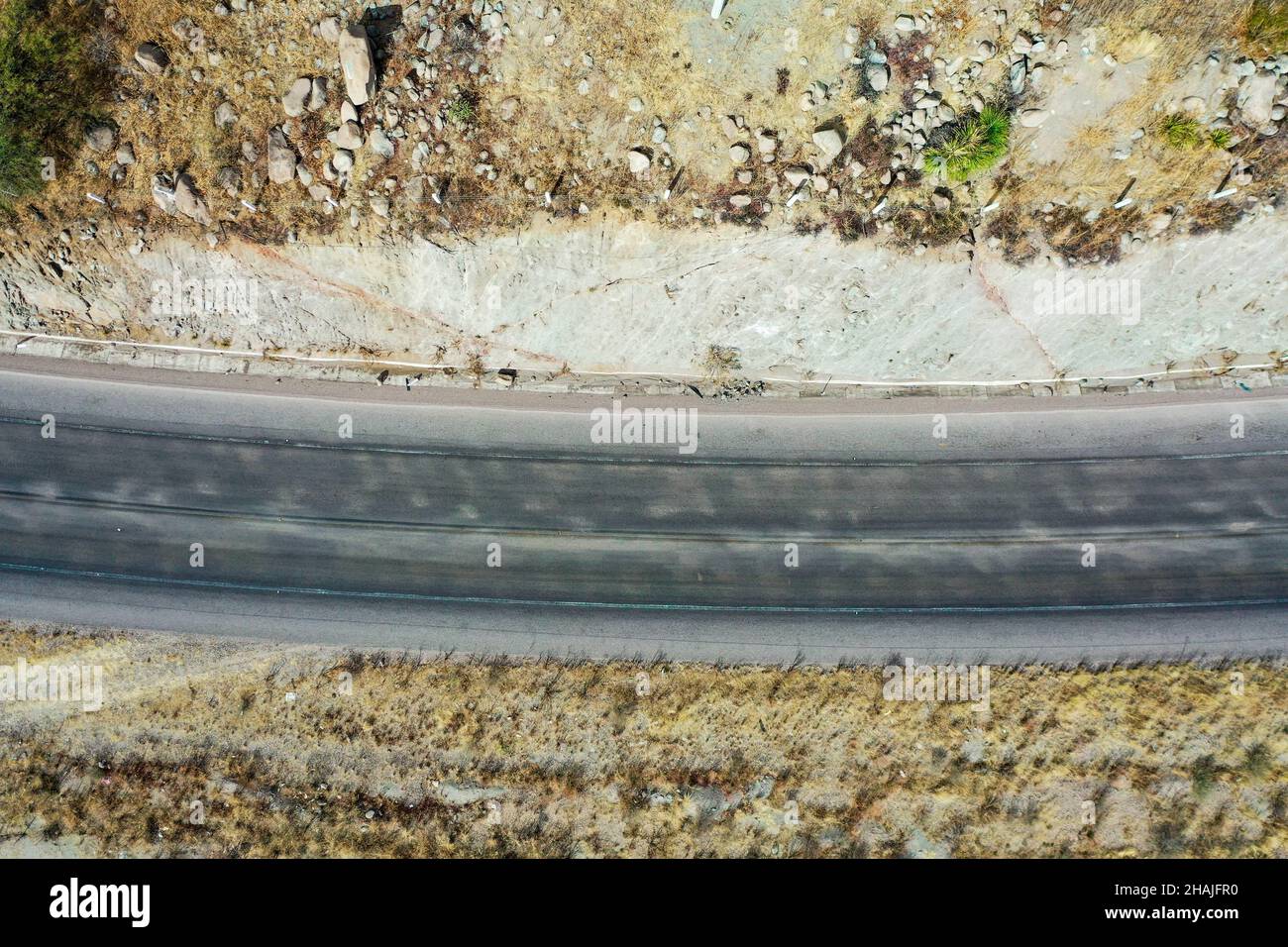 Aerial view of the landscape of the mountains and the road that goes ...