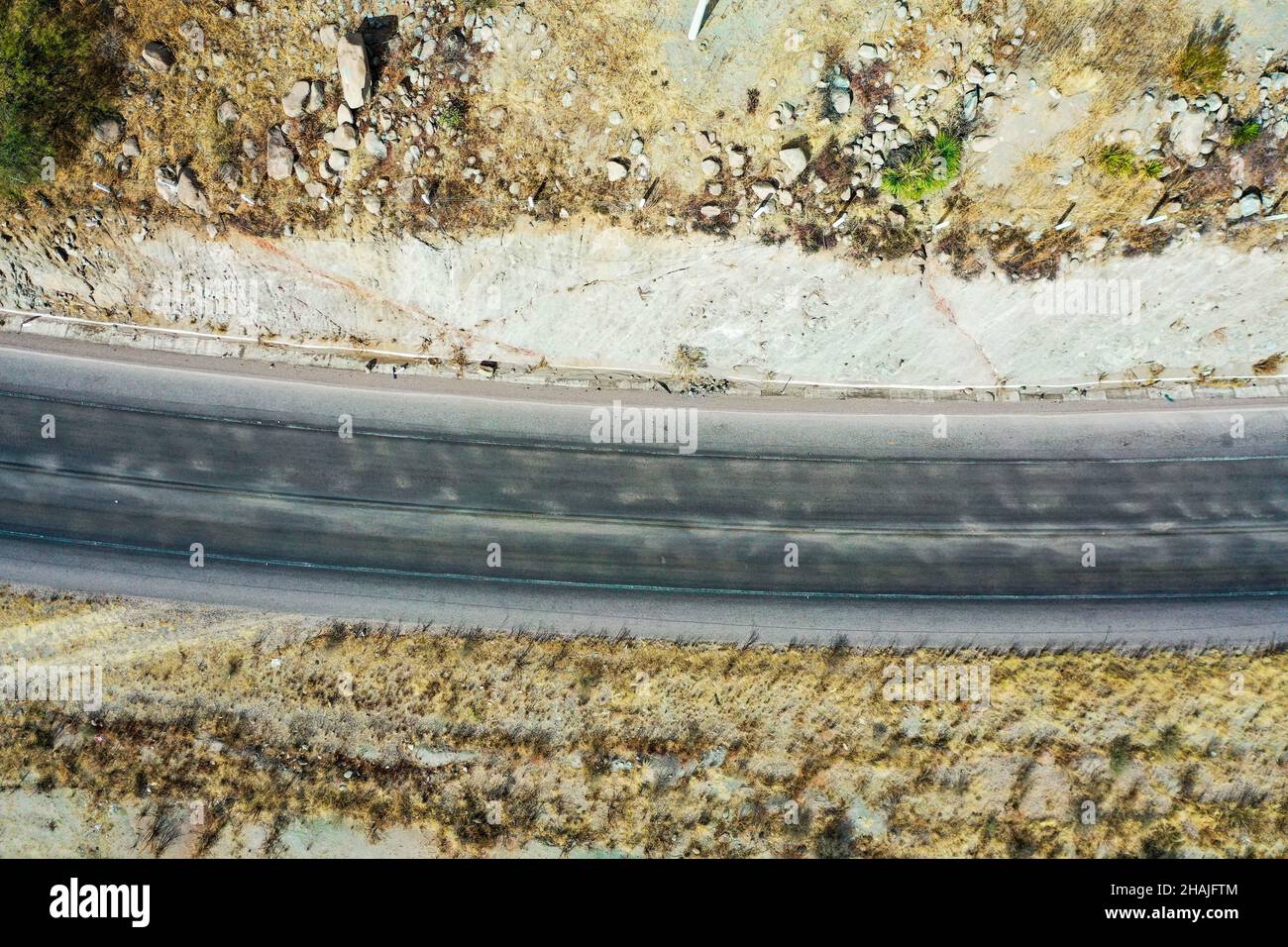 Aerial view of the landscape of the mountains and the road that goes ...