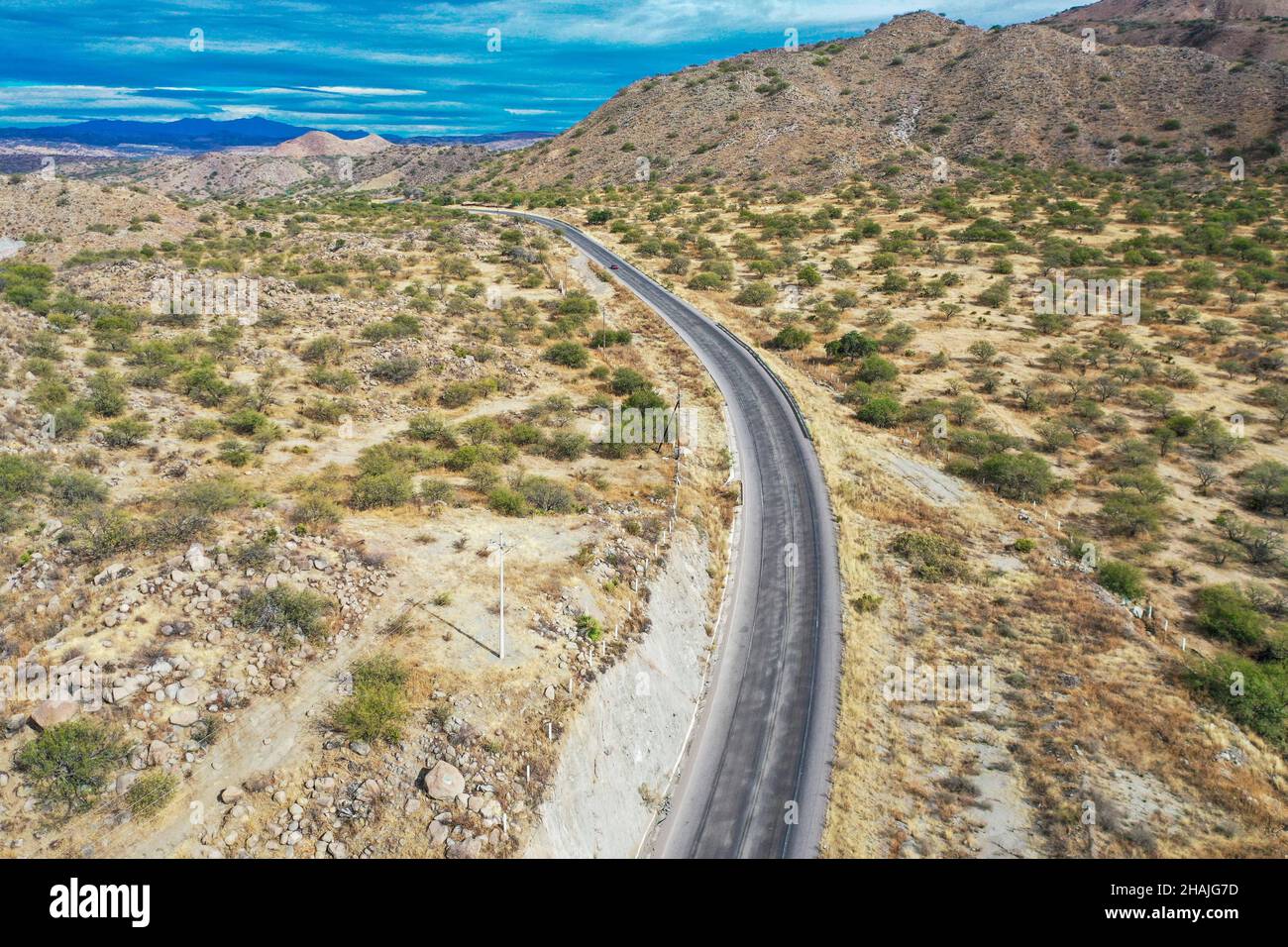 Aerial view of the landscape of the mountains and the road that goes ...
