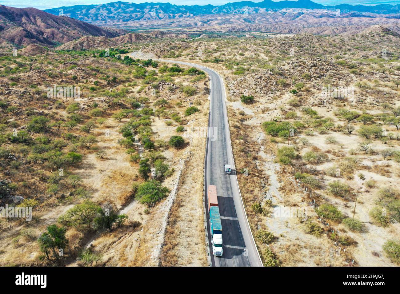 Aerial view of the landscape of the mountains and the road that goes ...
