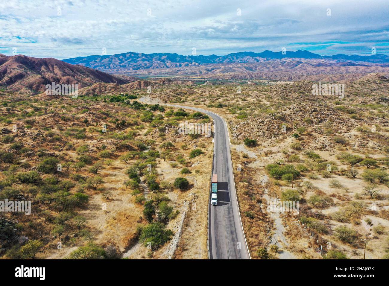 Aerial view of the landscape of the mountains and the road that goes ...