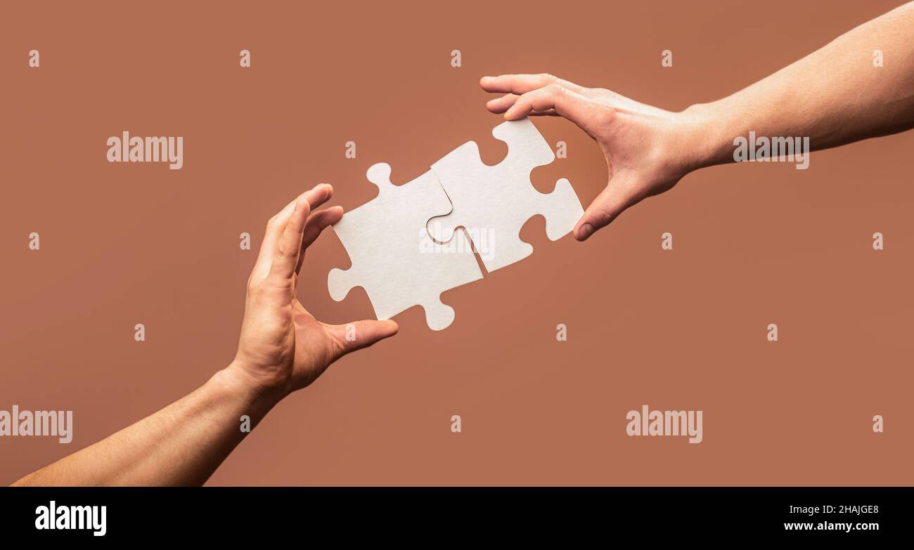 Hand connecting jigsaw puzzle. Business solutions, success and strategy ...