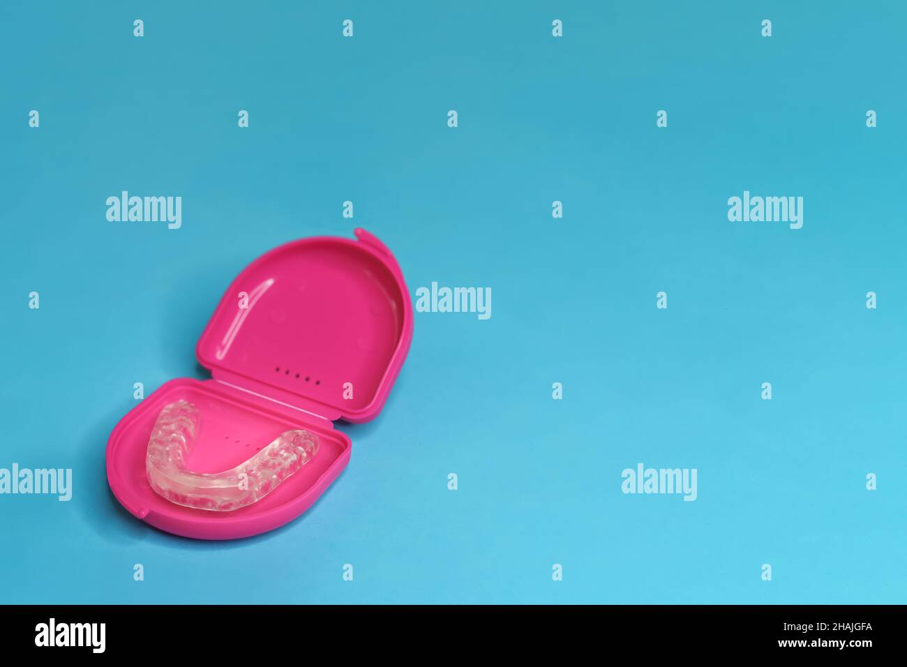 dental retainer teeth in a pink boxset Stock Photo - Alamy