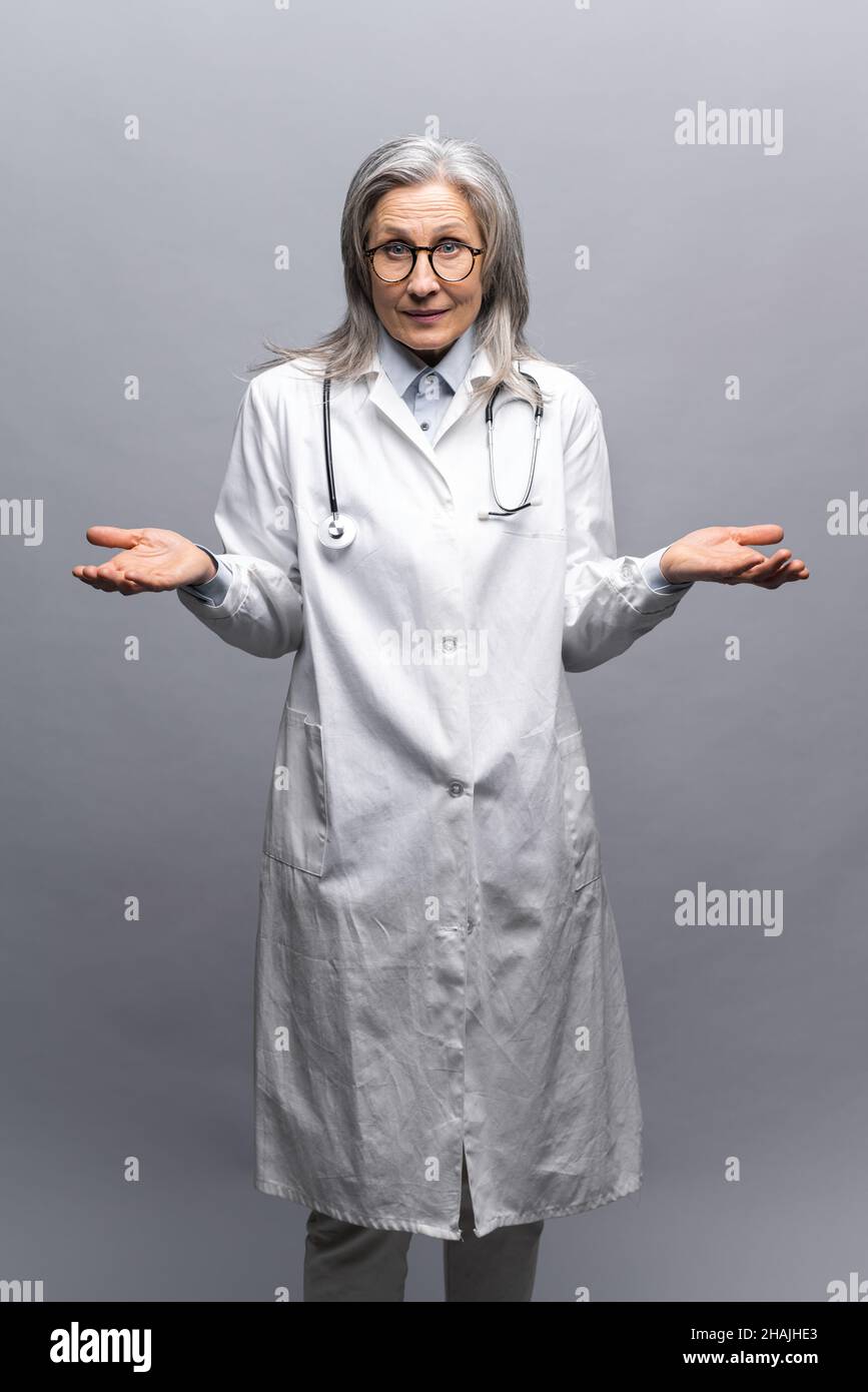 Confused healthcare doctor standing looking hi-res stock photography ...