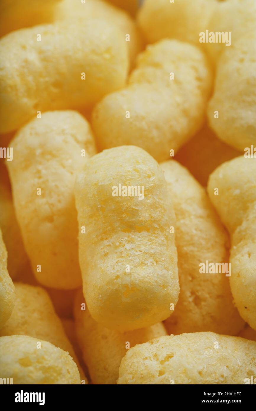 Yellow dessert Corn sticks in powdered sugar texture. Treats Stock ...