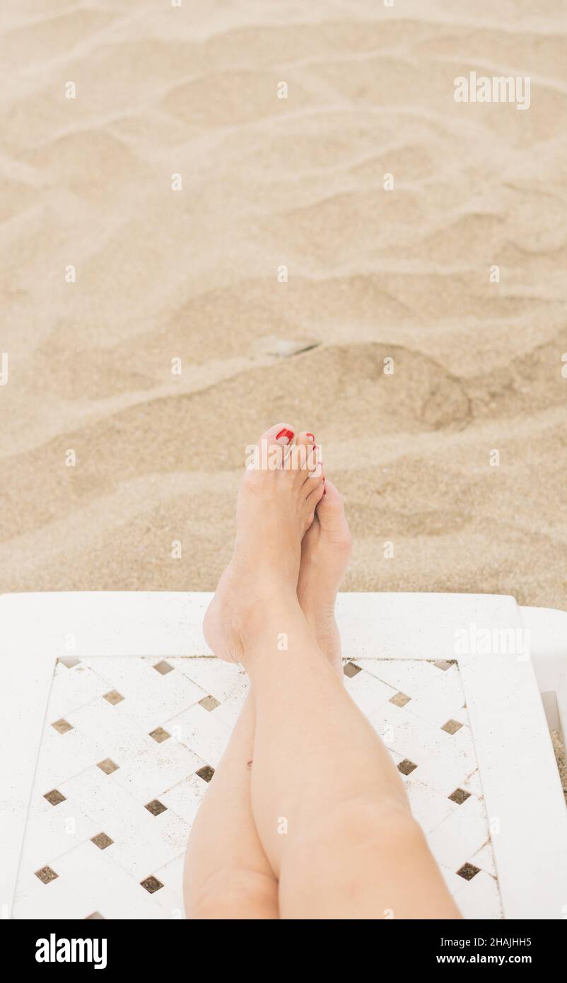 High angle shot of a female's legs at a private beach in Ecuad Stock ...