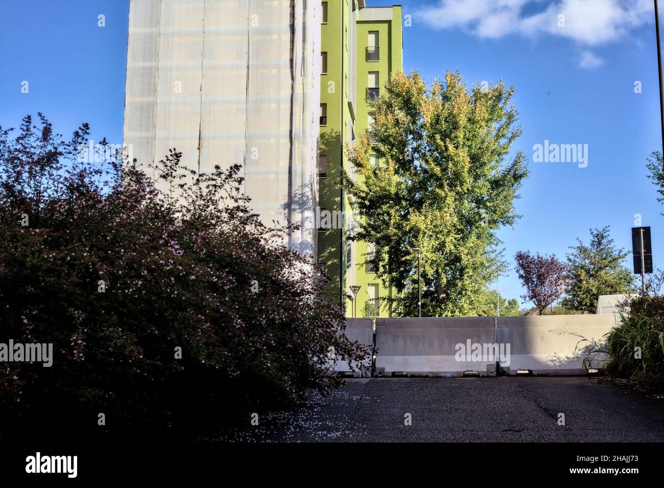 Blocked passage in a residential area with a building under maintenance ...