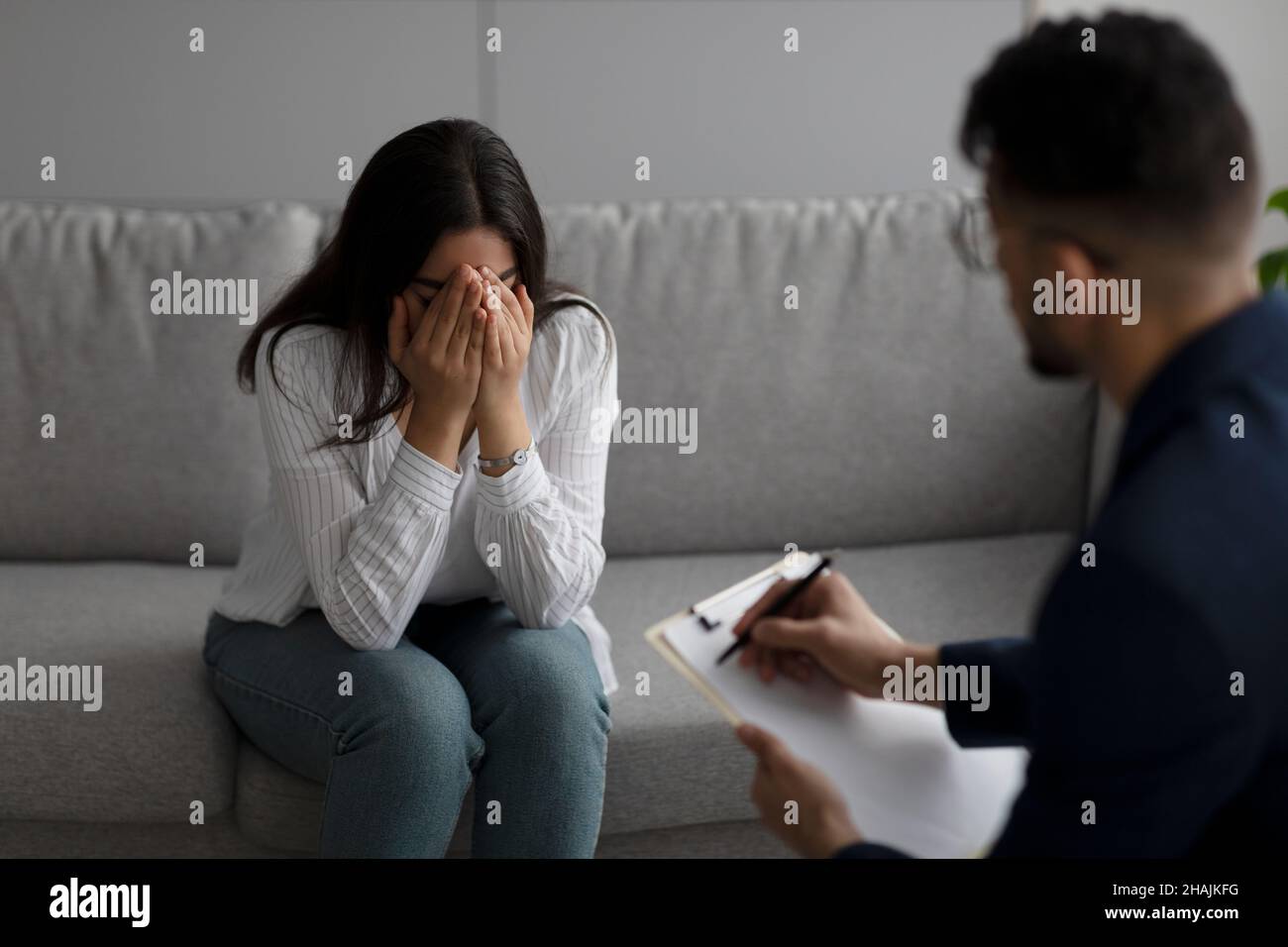Depressed arab lady consulting psychologist and crying, woman with ...