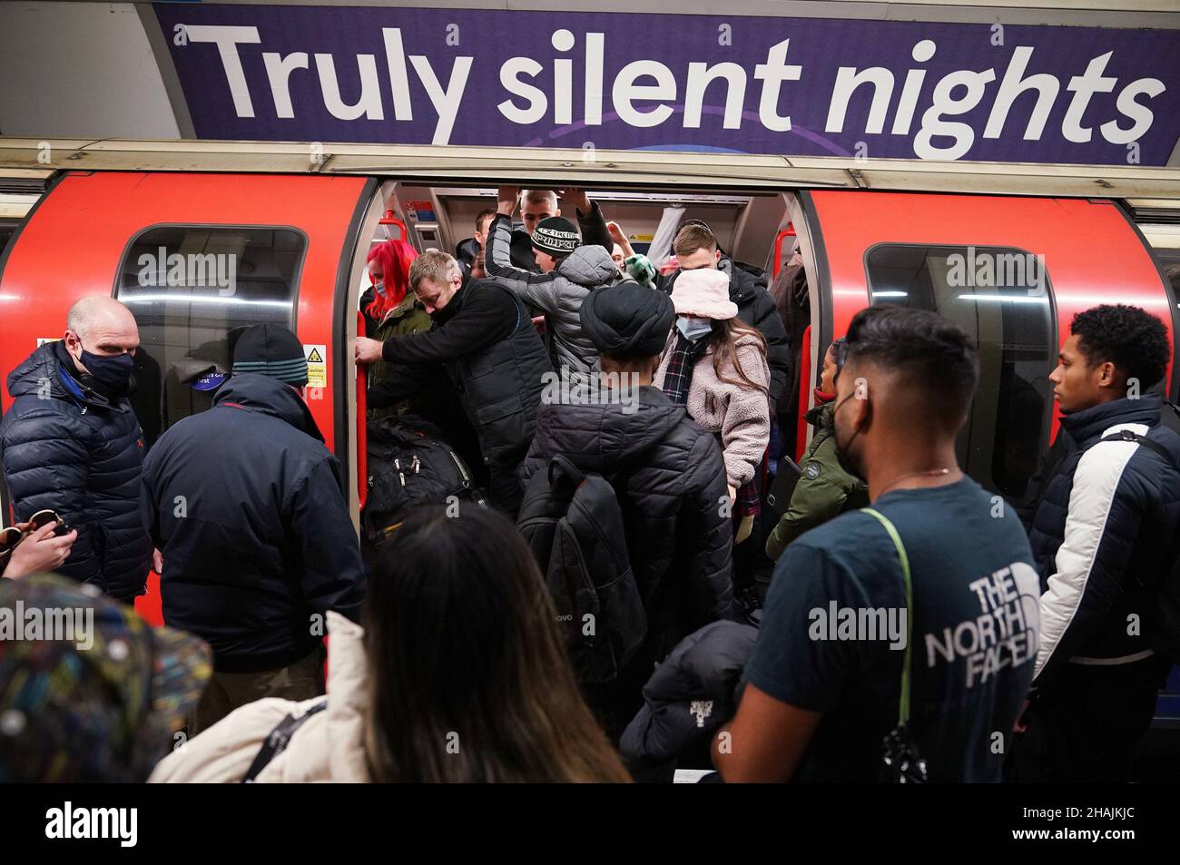 Commuters on the eastbound Central Line platform at Oxford Circus ...