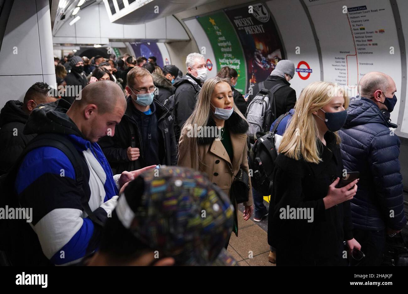 Commuters on the eastbound Central Line platform at Oxford Circus ...