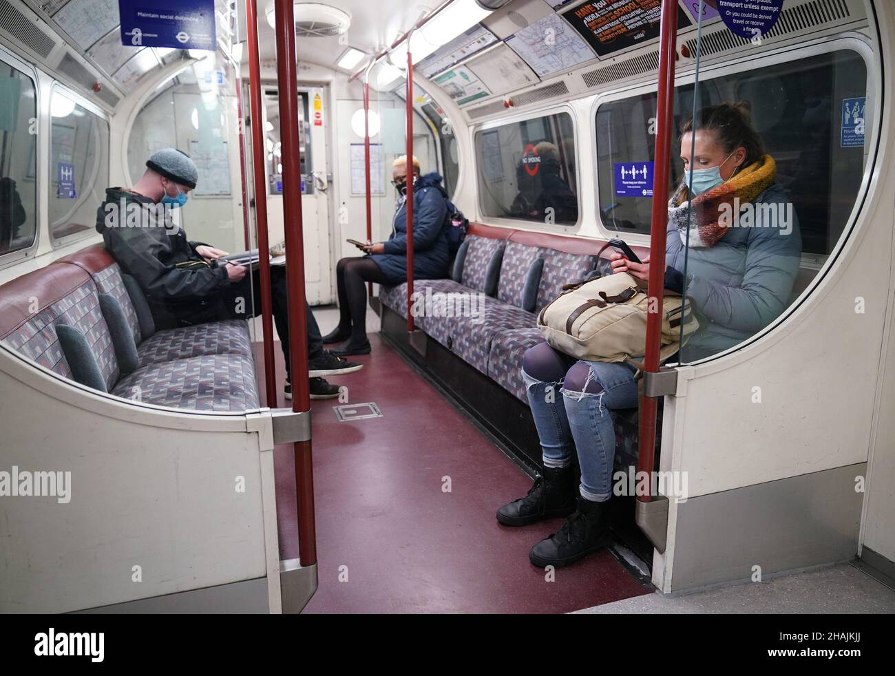 Commuters on a northbound Bakerloo Line Underground train carriage at ...