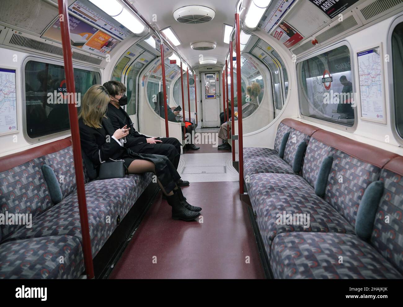 Commuters on a northbound Bakerloo Line Underground train carriage at ...