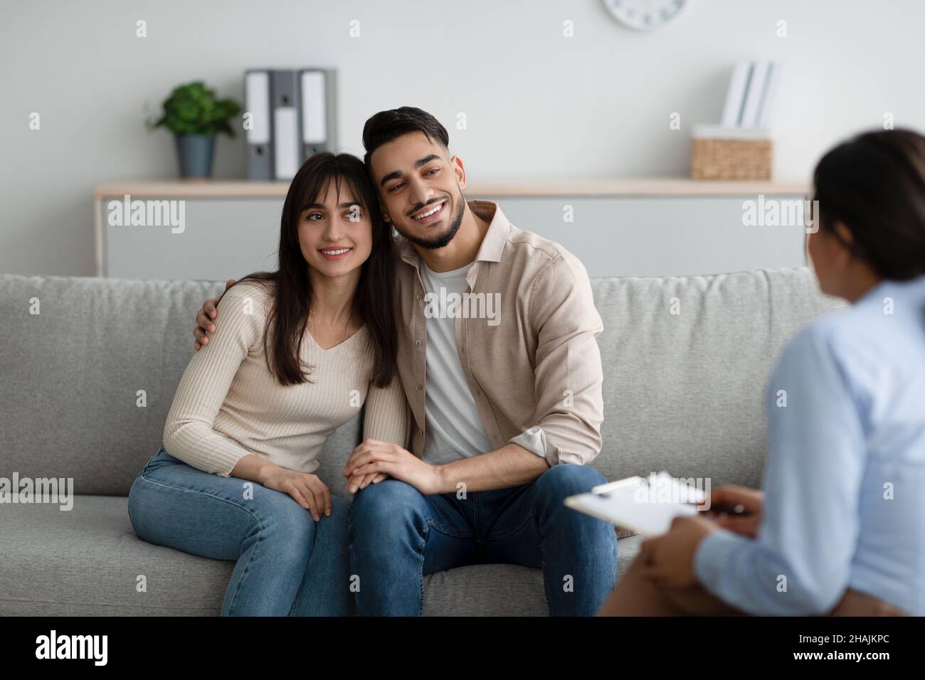 Arab married couple hugging after effective psychotherapy, spouses ...