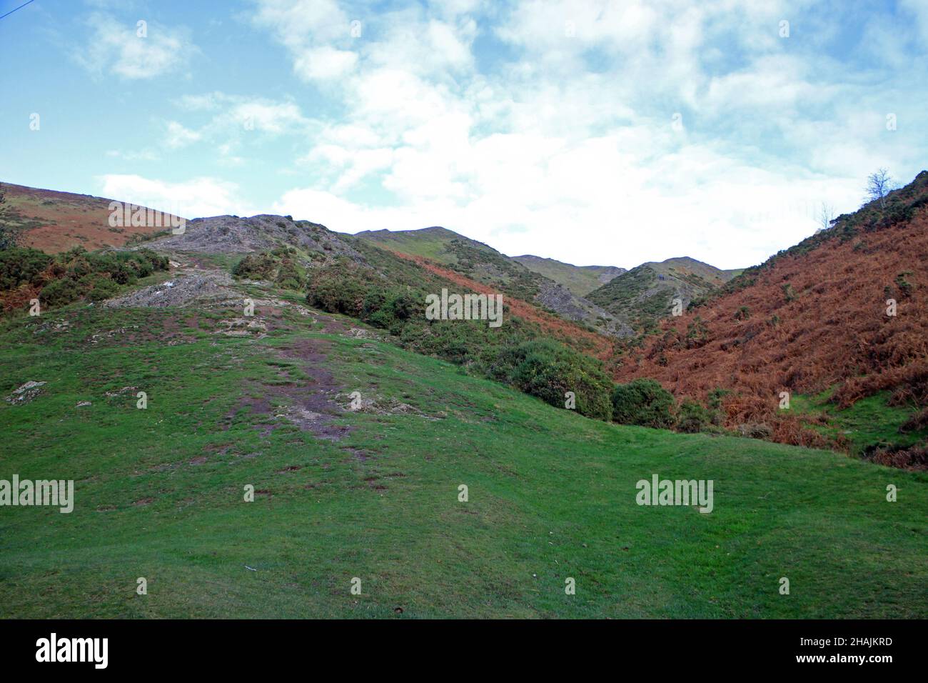 Adults walking hills in the Carding Mill Valley, Church Stretton ...