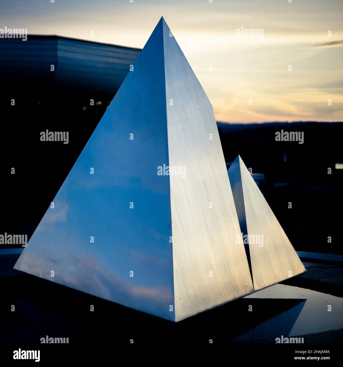 Metallic pyramid shape structure on a sunset Stock Photo - Alamy
