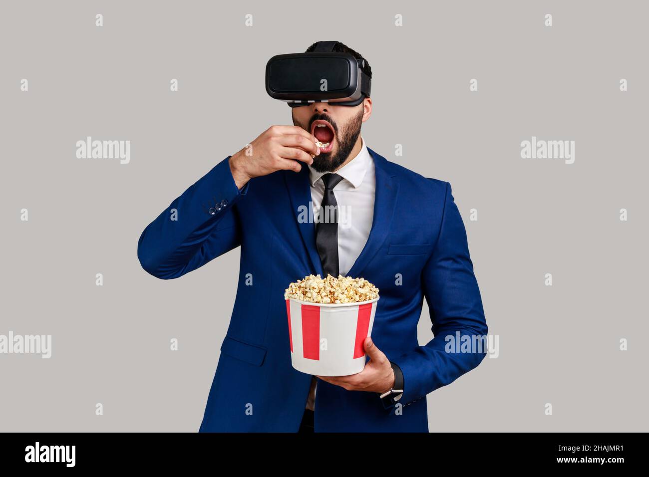 Indian man eating popcorn watching hi-res stock photography and images ...
