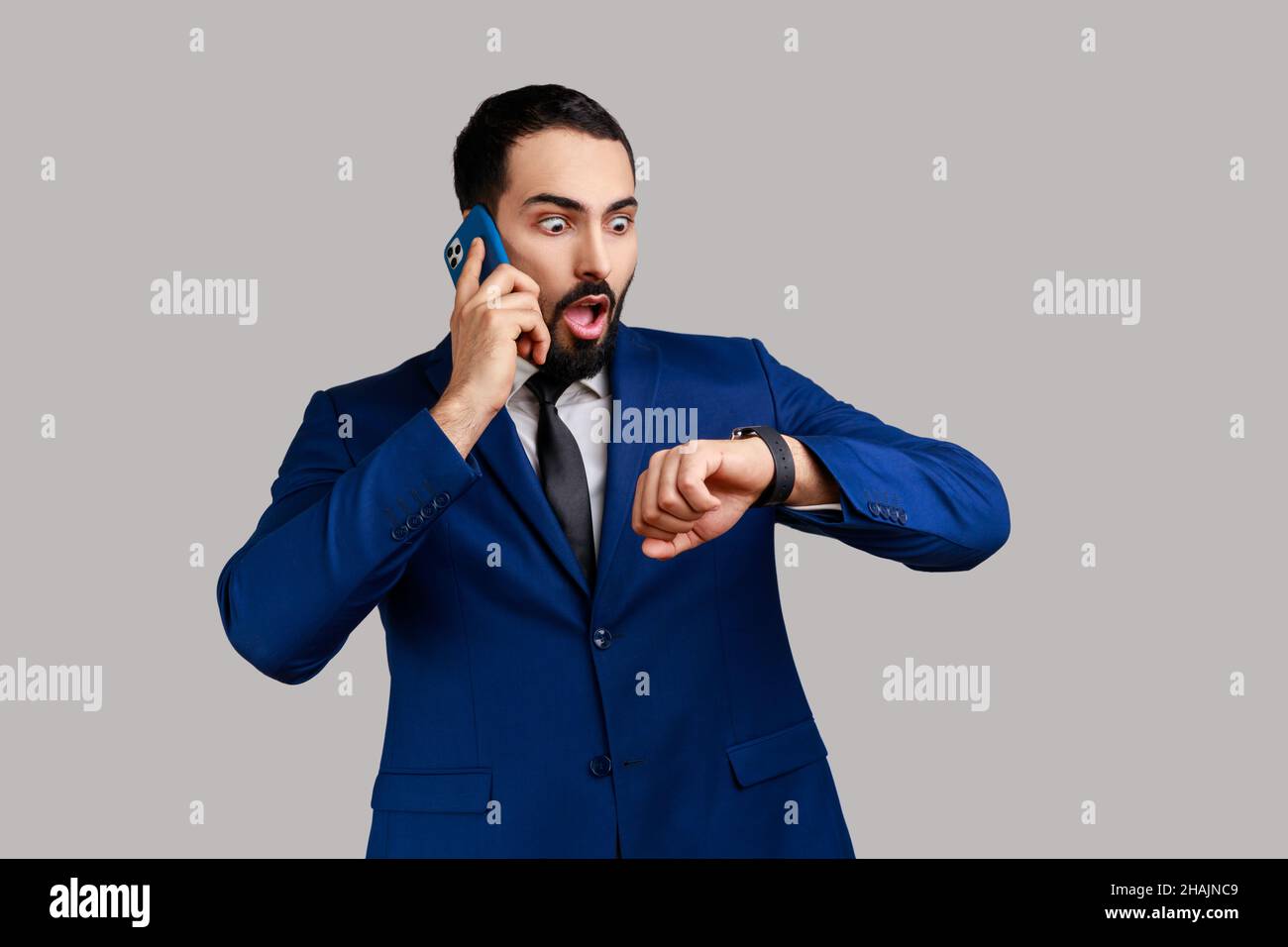 Man with suit and watch on hand hi-res stock photography and images - Alamy