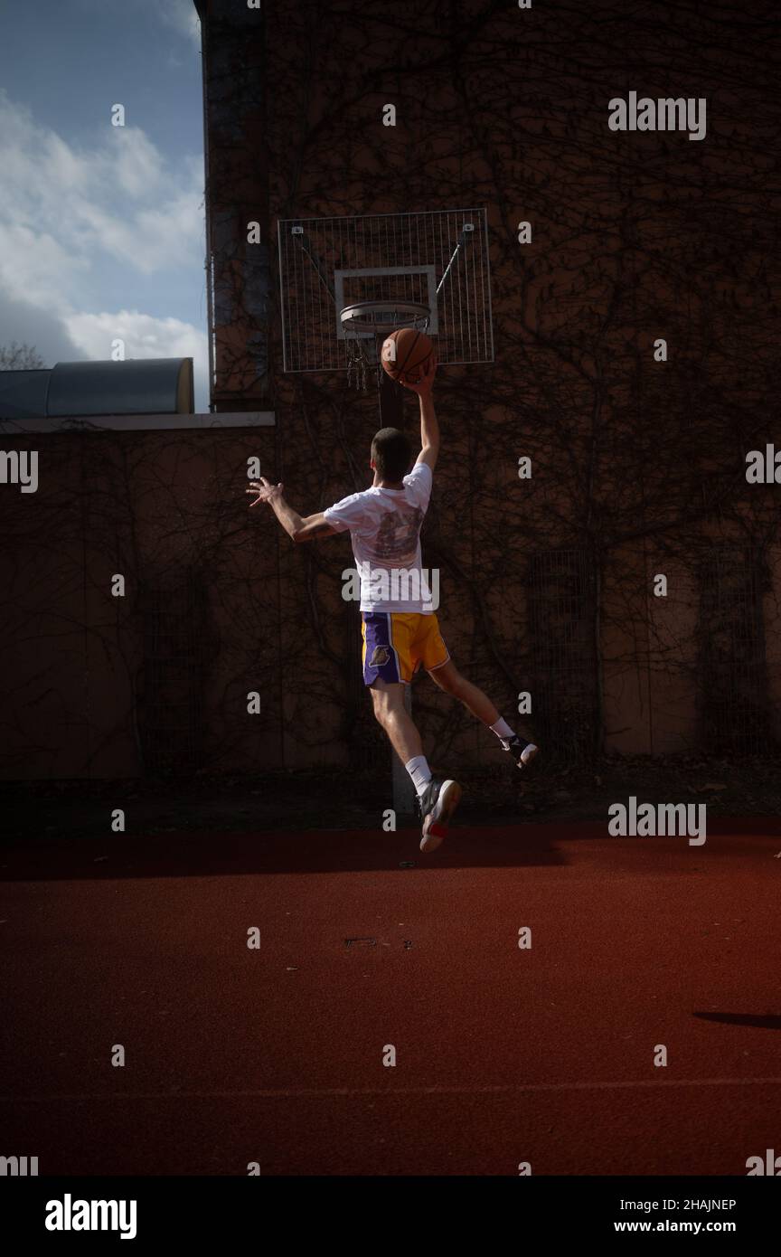 Vertical shot of the player making a dunk Stock Photo - Alamy