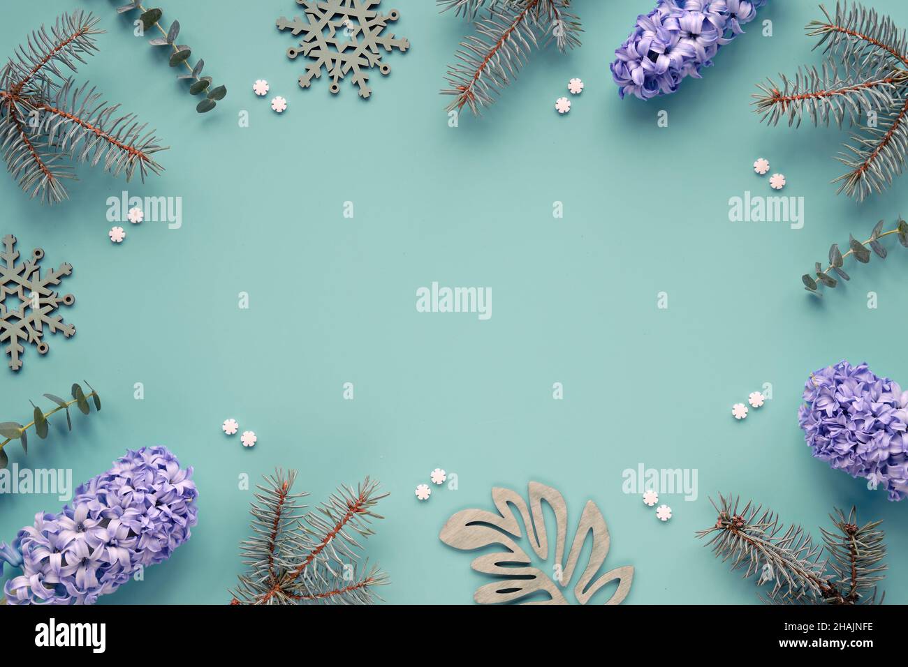 Green mint paper background with eucalyptus, fir twigs and blue ...