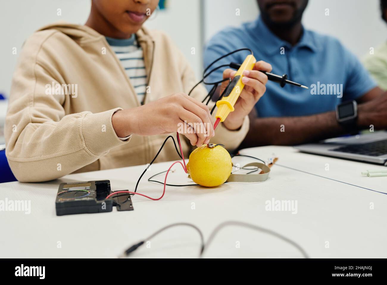 Close up of teenage girl working on science experiment in school ...