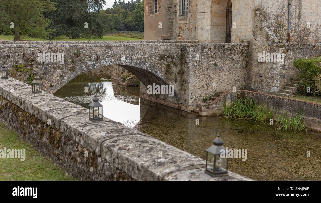Small stone brige over the meoat of a Loire Castle leading to the ...