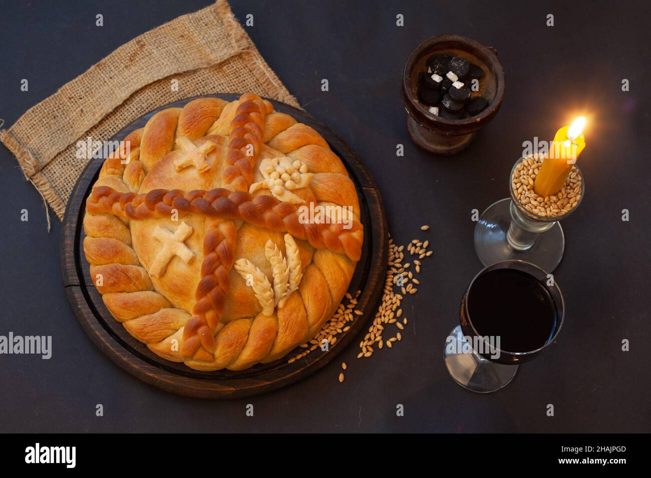 Serbian slava cake with wine and candle. Slavski kolač. Decorative ...