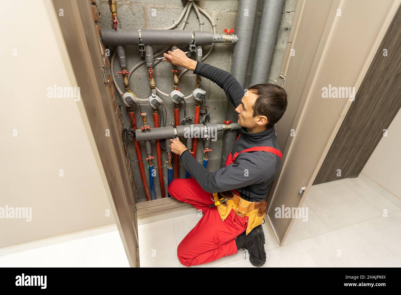 Plumber welded plastic pipes, worker repair Stock Photo - Alamy