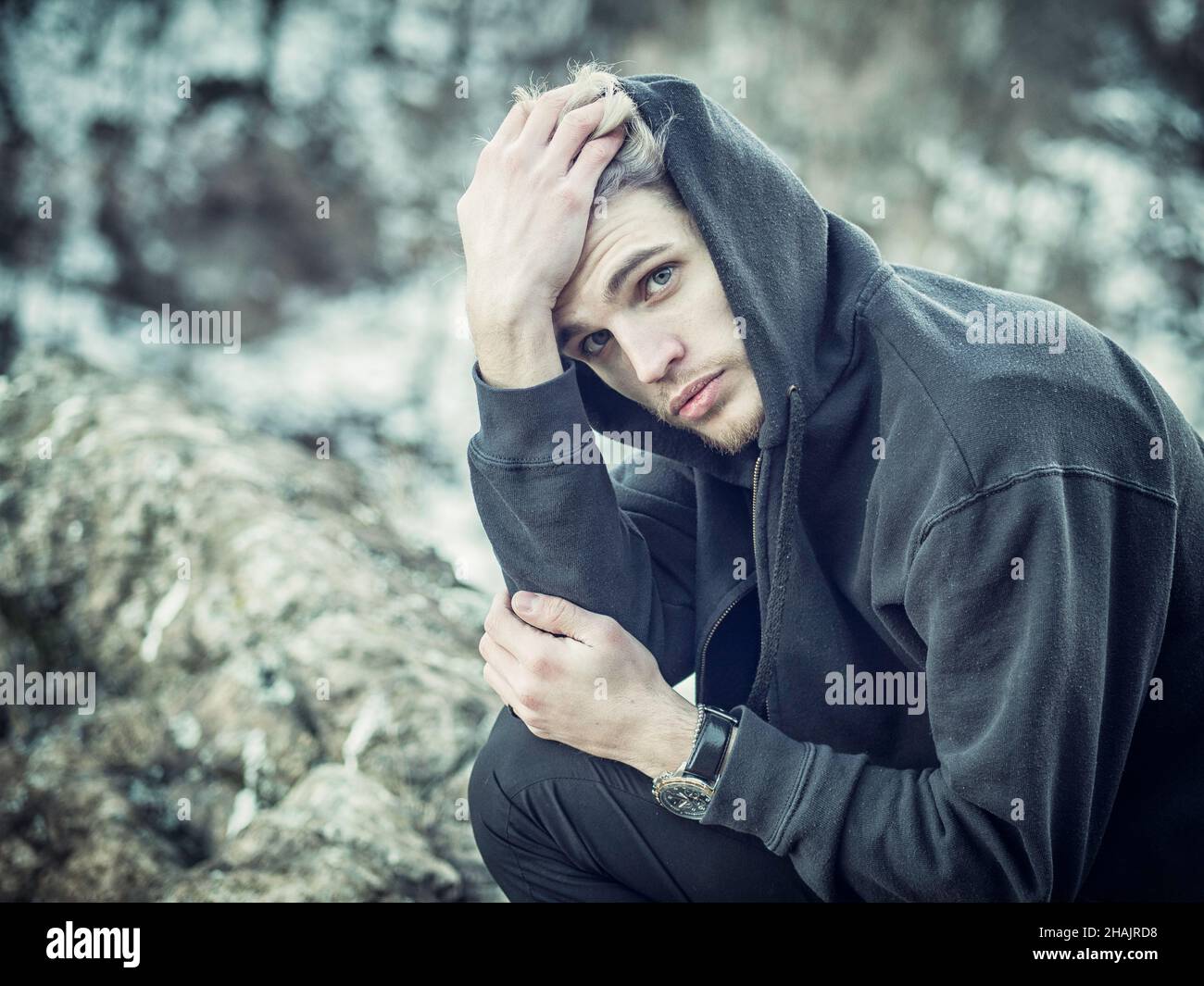 Male model posing in snow hi-res stock photography and images - Alamy