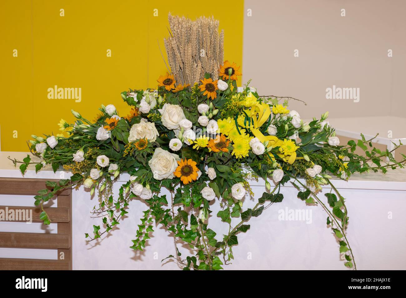 Composition of Flowers with White Roses, Sunflowers, and Wheat Spikes ...