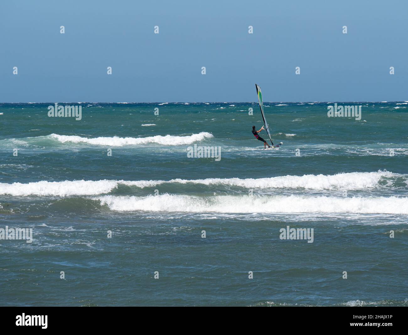 Windsurf Riding the Waves in a Choppy Sea Stock Photo - Alamy