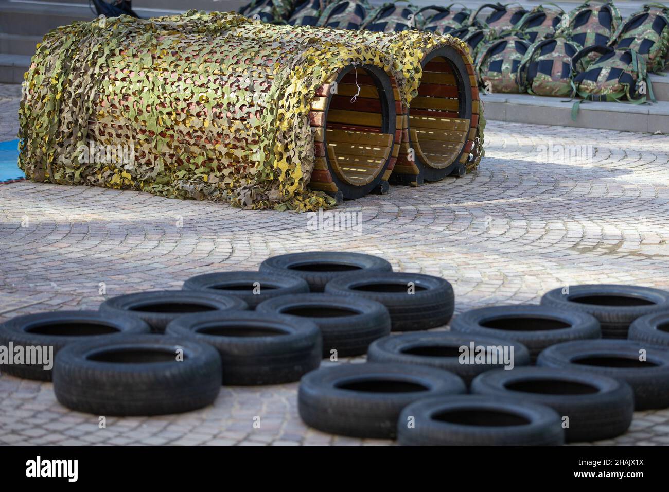 Car Tires placed Horizontally in the Ground and Military Exercise ...