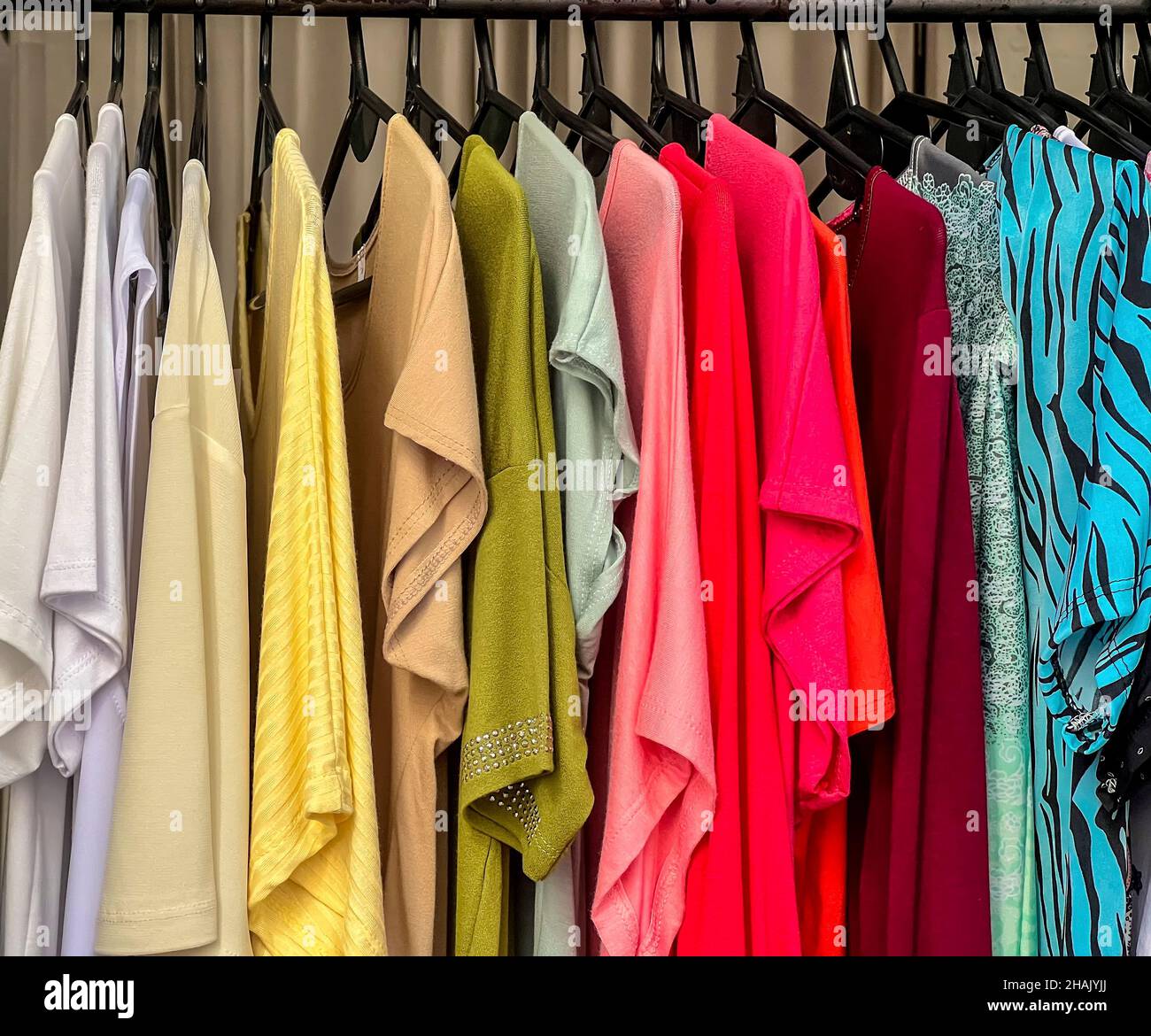 clothes on rack in store Stock Photo - Alamy