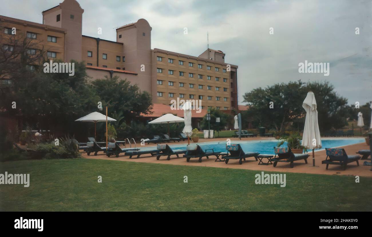 Sunbeds around a swimming pool at a luxury hotel in Gaborone, Botswana ...