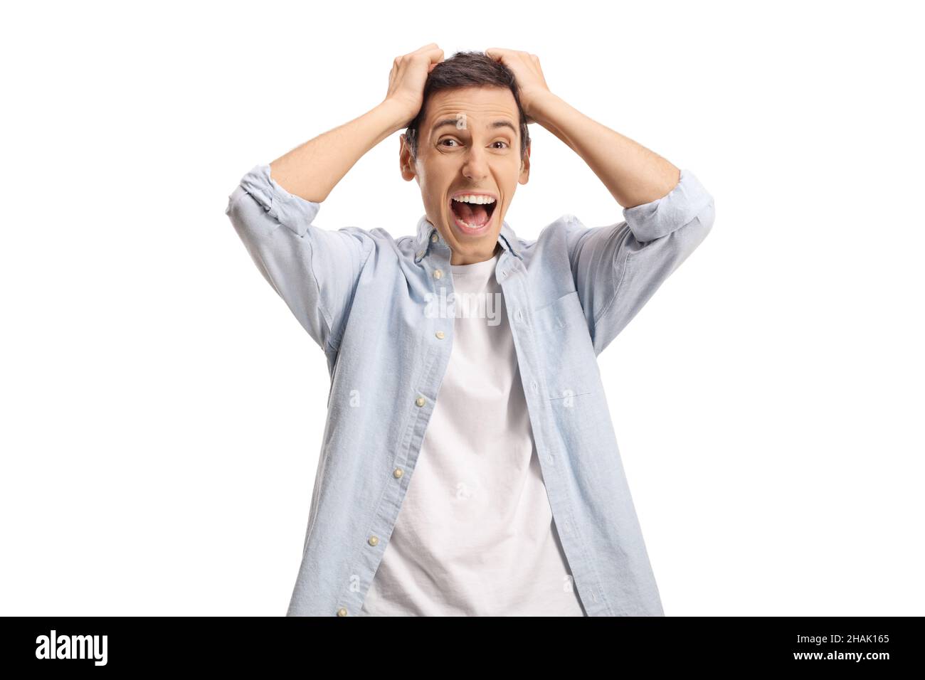 Extremly happy casual young man holding his head isolated on white ...