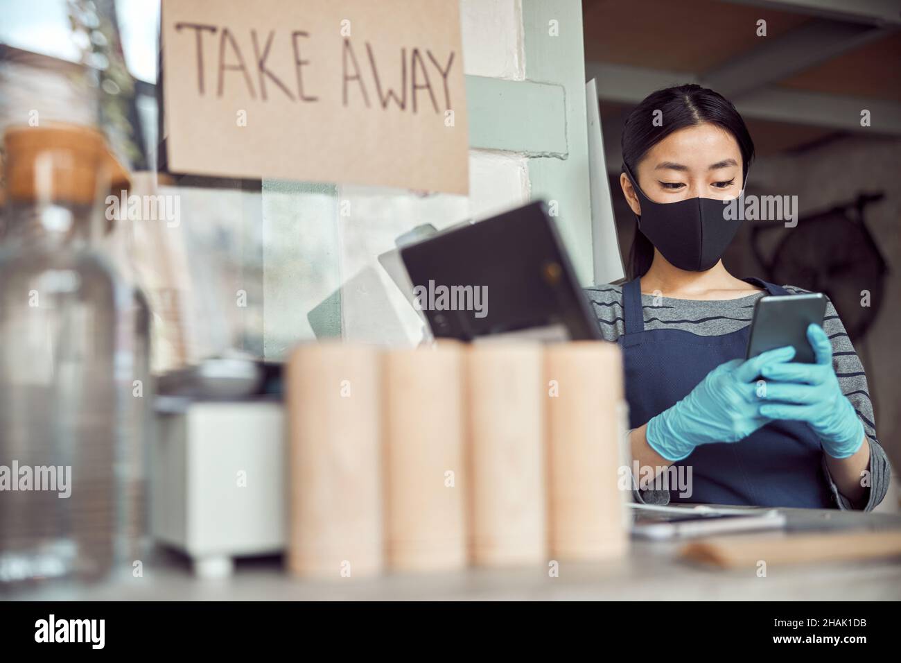 Cafe worker taking order from customer in coffee shop Stock Photo - Alamy