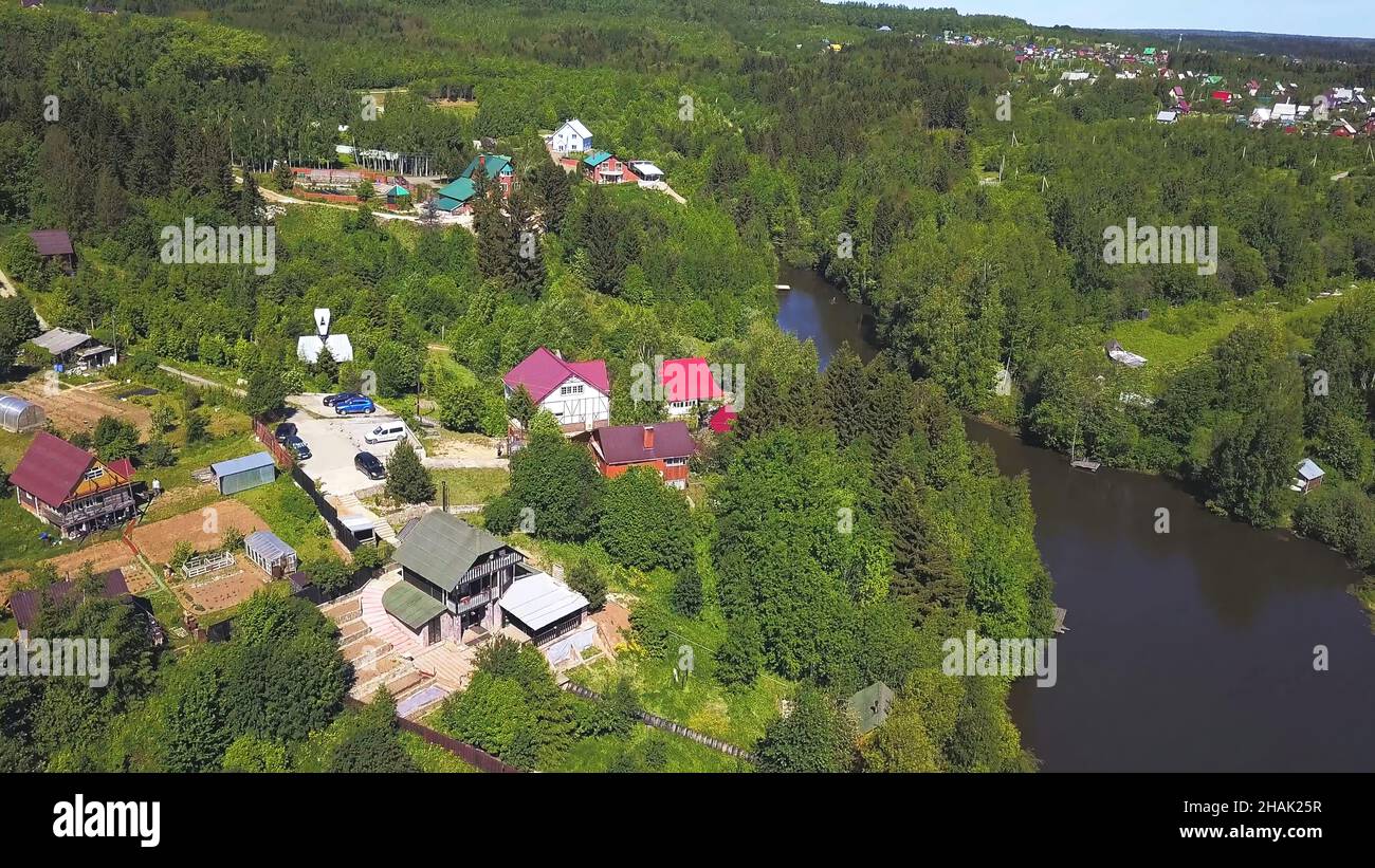 Top view of country village in suburbs with pond. Clip. Top view of ...