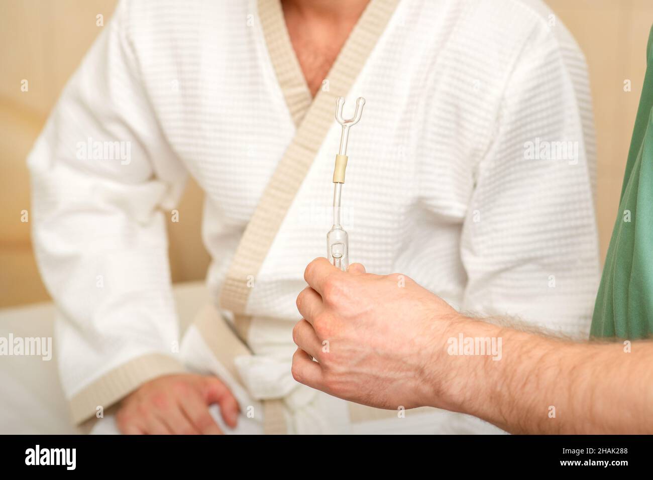 Doctor giving nasal inhalator with essential oil Maholda to a male ...