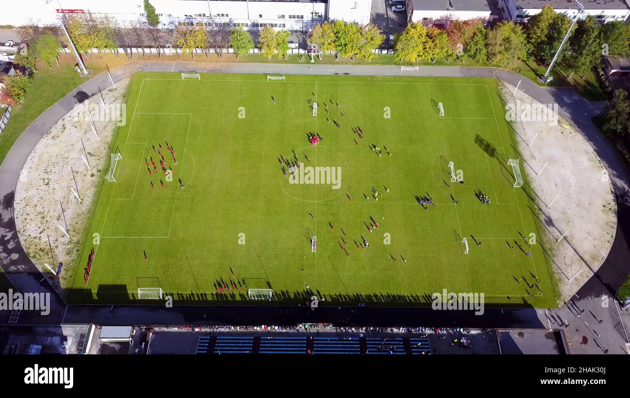 Football players running around the football field. Top view of the ...