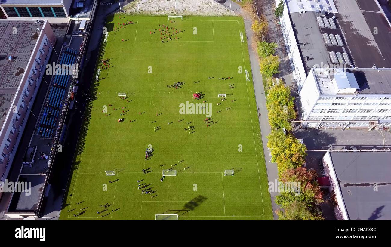 Football players running around the football field. Top view of the ...