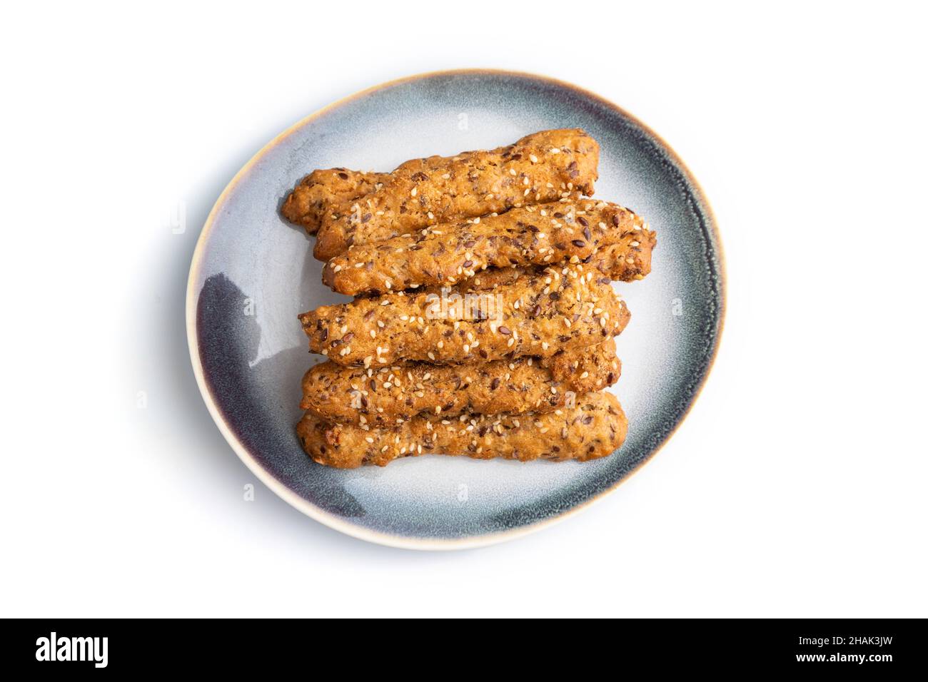Crumble cookies with seasme and almonds on ceramic plate isolated on ...