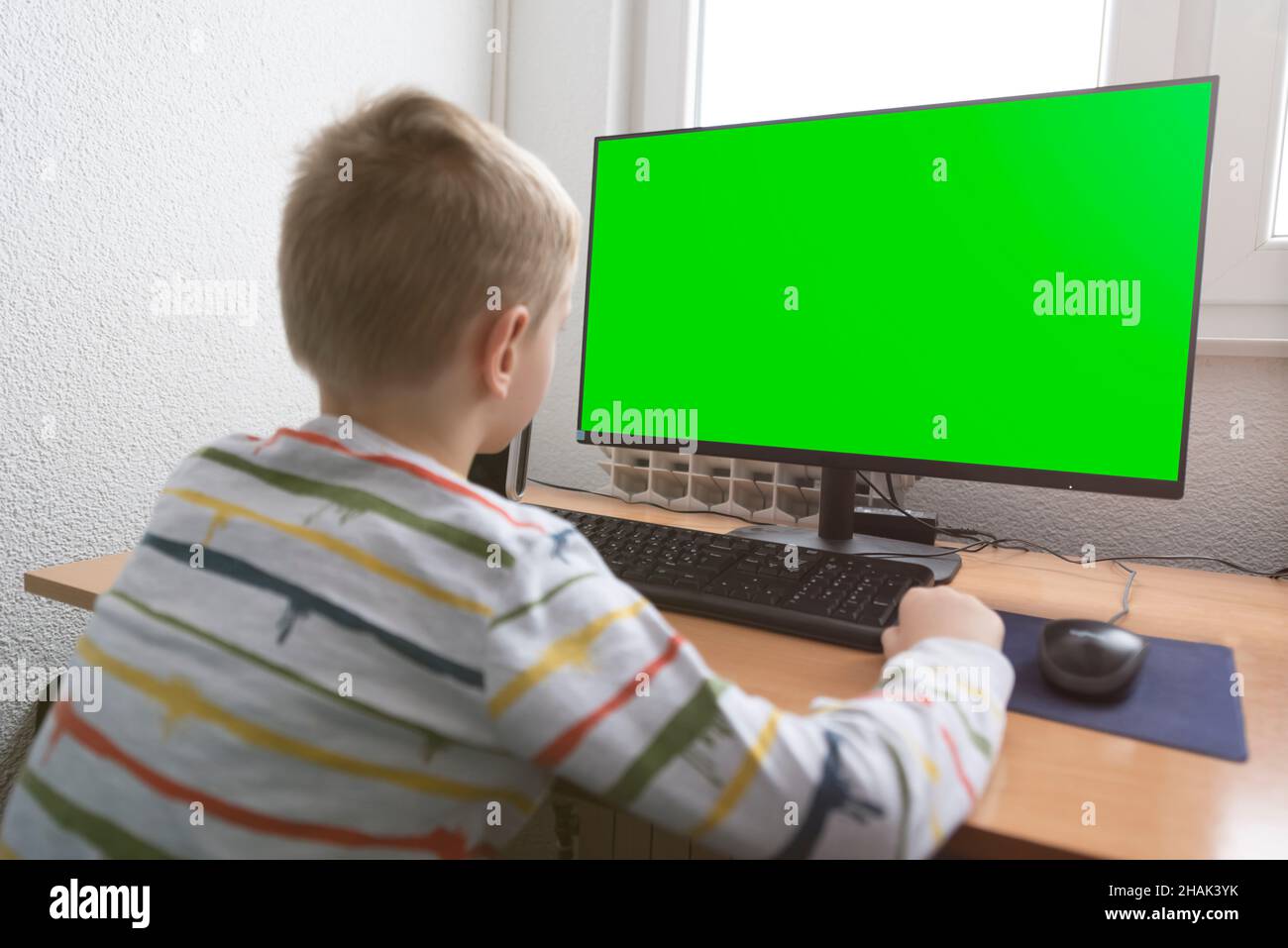Young boy student video conference e-learning with teacher on computer ...