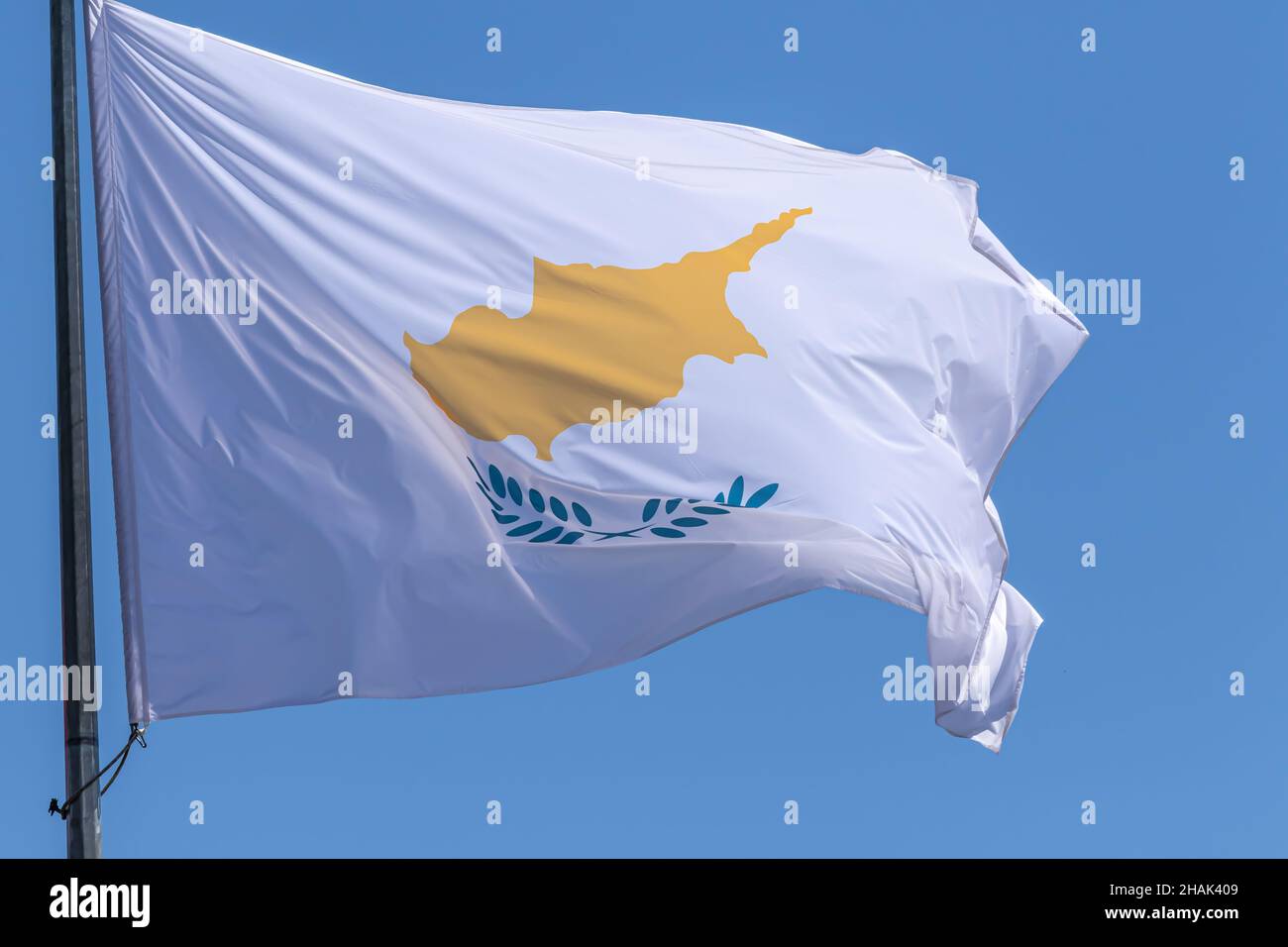 Cypriot national flag waving on blue sky background. Republic of Cyprus ...